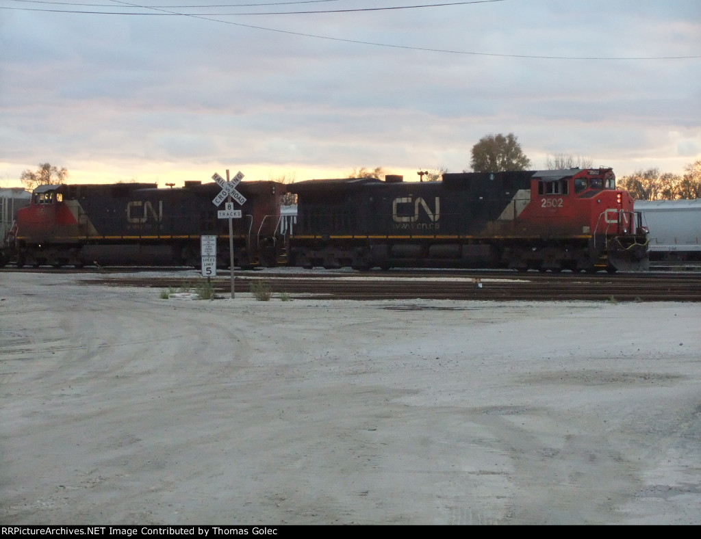 CN 2502 leads a westbound manifest through Joliet Yard